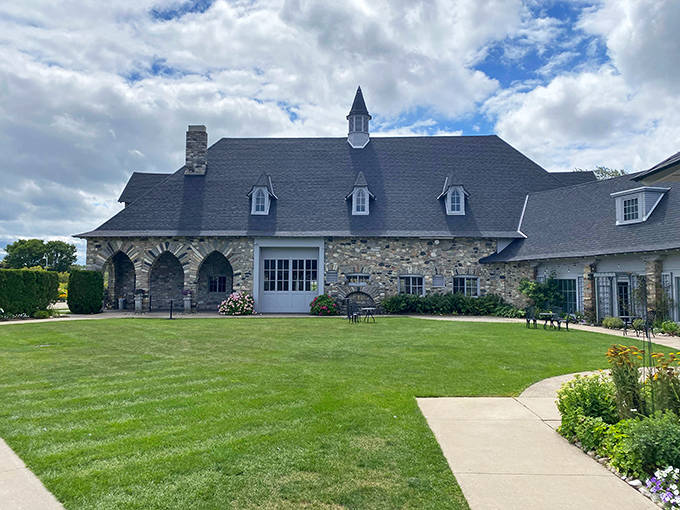 The expansive grounds stretch toward the horizon, offering visitors a taste of European grandeur in Michigan's northern reaches.
