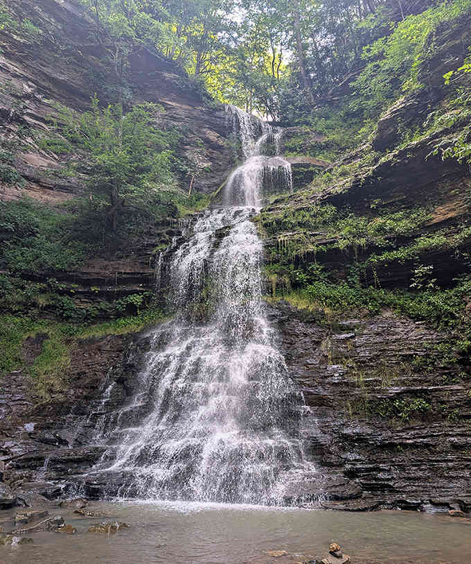 West Virginia's roadside wonder creates a lacy curtain of water against moss-covered rocks, accessible without a strenuous hike.
