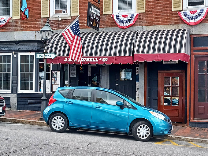 American flags flutter above J.R. Maxwell's entrance, where the black and white striped awning has become a landmark for hungry Bath visitors.