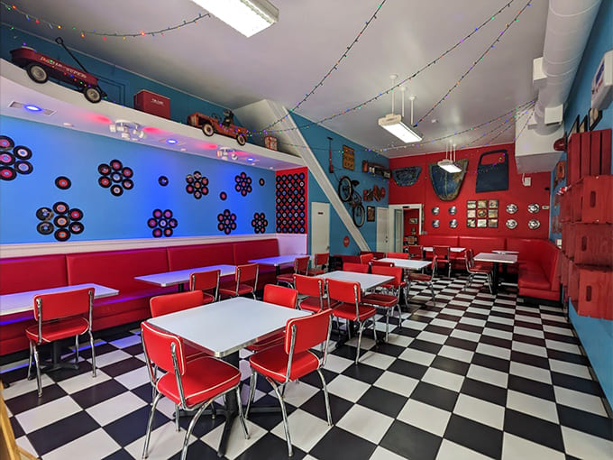 The retro interior with checkered floors and bright colors creates the perfect backdrop for enjoying premium ice cream.