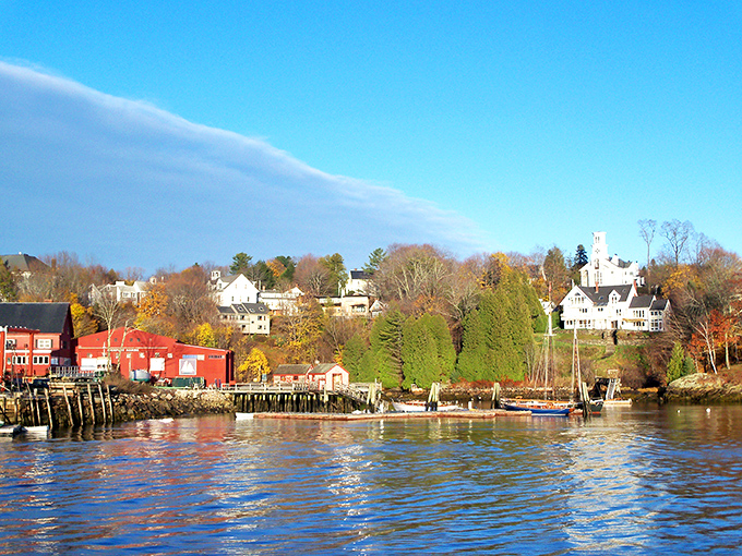 The view across Rockport Harbor captures Maine coastal living at its finest, with clear waters reflecting the distinctive architecture of this artistic community.