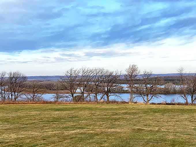 The Mississippi River stretches to the horizon from Spring Lake's overlook, a patchwork of water, islands, and distant bluffs.