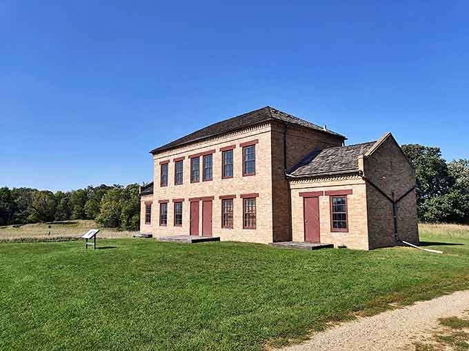 The historic brick building at Upper Sioux Agency State Park stands as a testament to Minnesota's past, preserved amid the natural beauty of the park.