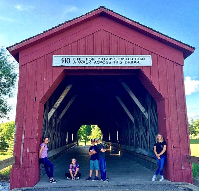 A sign warns of a "$10 fine for driving faster than a walk" &ndash; a charming reminder of simpler times at this historic bridge.