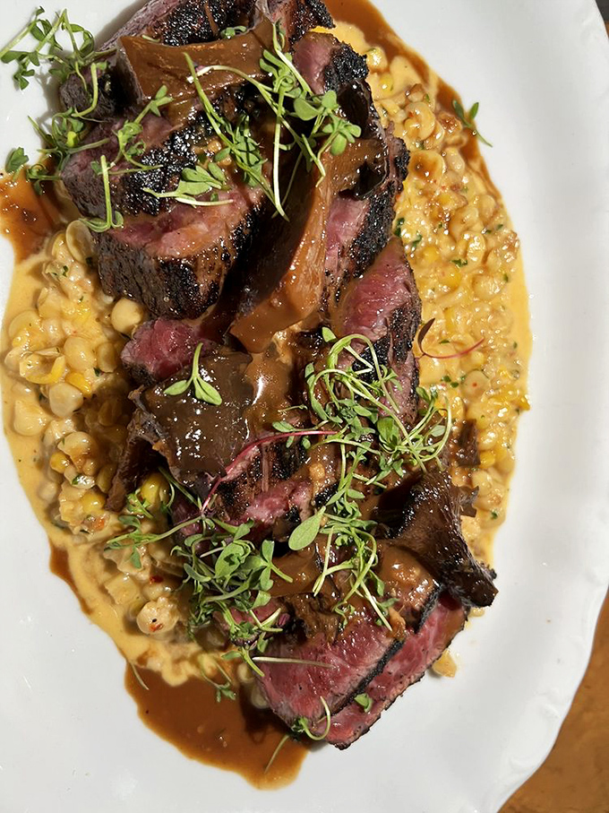 Australian Wagyu sliced to perfection atop creamy corn &ndash; a dish that proves simplicity and luxury aren't mutually exclusive.