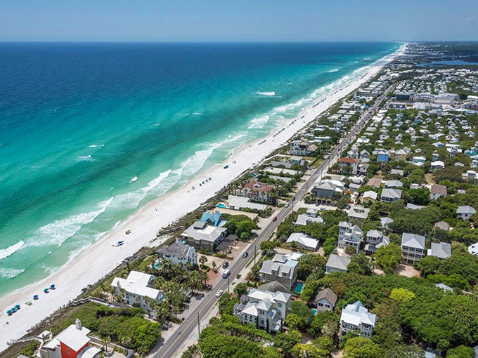 Beach homes line the shore like colorful sentinels, their residents enjoying front-row seats to nature's daily spectacle.