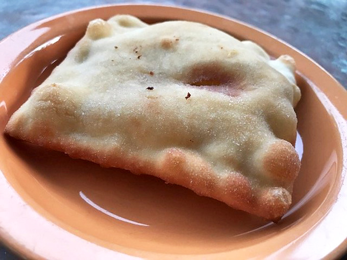 Sopapillas swimming in honey are basically edible clouds that decided to get sweet and sticky, and we're here for it.