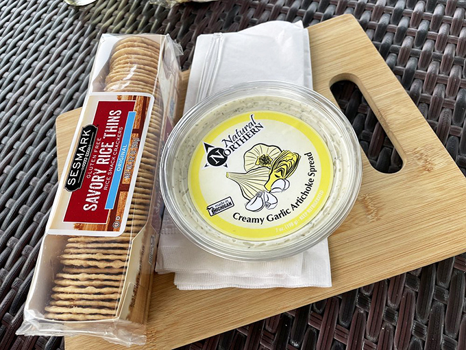 The perfect prelude to wine tasting: Creamy garlic artichoke spread and crisp crackers &ndash; humble companions that elevate every sip.