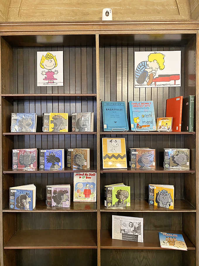 Charlie Brown and Schroeder watch over a delightful collection of Peanuts books, celebrating Minnesota native Charles Schulz's beloved characters.