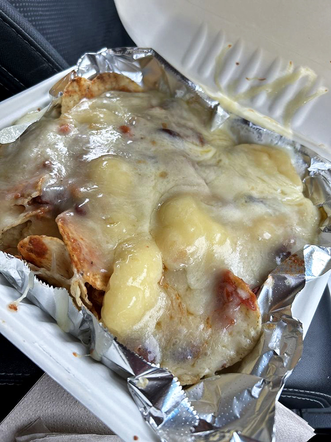 Melted cheese cascading over chips like a dairy waterfall. Nachos that make you wonder why you ever settled for less.