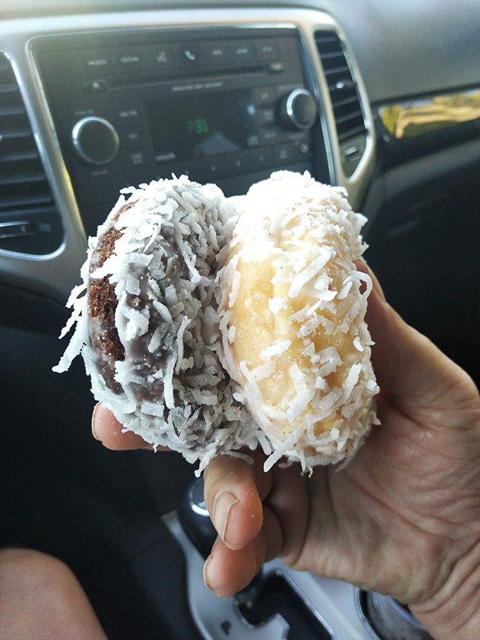 Coconut-covered donuts that look like they're wearing tiny winter sweaters made of sweetened snowflakes.