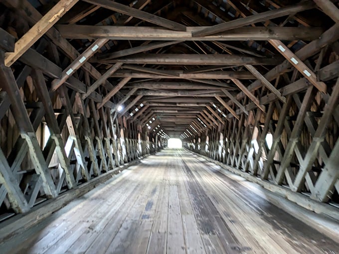 Step inside to discover an architectural marvel &ndash; the lattice truss design creates a mesmerizing wooden cathedral effect along the 460-foot span.
