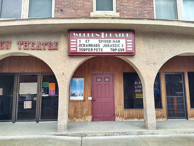 The theater entrance with its current lineup displayed proudly &ndash; a rotating showcase of Hollywood's latest offerings brought to small-town Vermont.