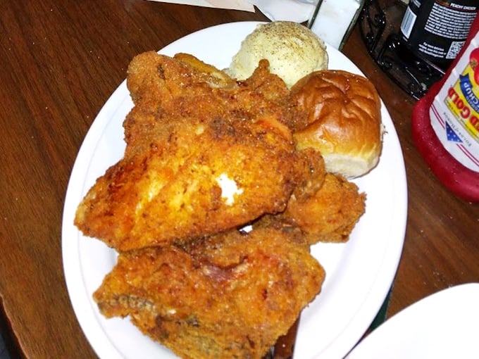 Crispy fried chicken with that perfect crunch-to-juiciness ratio, served with sides that would make any grandmother proud of the kitchen.