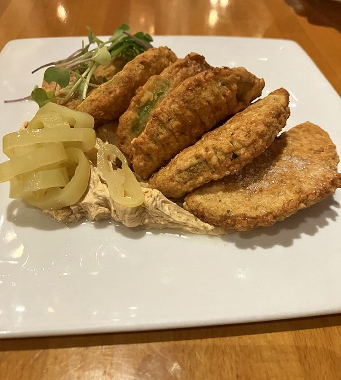 Golden-fried delicacies perch alongside pickled vegetables &ndash; a study in contrasts that delights both the eye and palate.