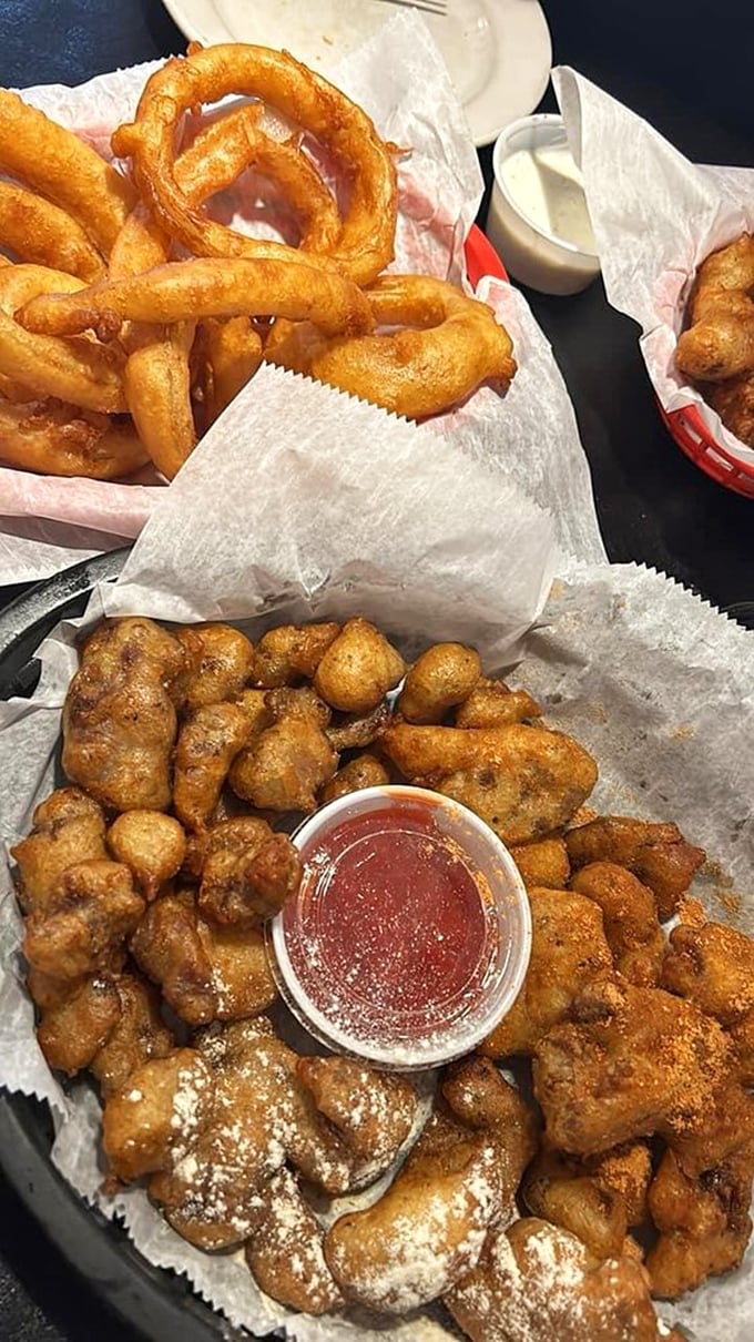 A basket of Joe's legendary gizzards alongside perfect onion rings. This combination plate is the culinary equivalent of hitting the jackpot in flavor town.