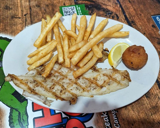 Perfectly grilled grouper that makes you wonder if the chef has some kind of fish telepathy &ndash; simple perfection with golden fries.