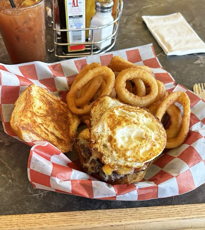 The legendary Hangover Burger with its crown of golden onion rings – because sometimes the cure for what ails you comes on a plate, not in a pill bottle.