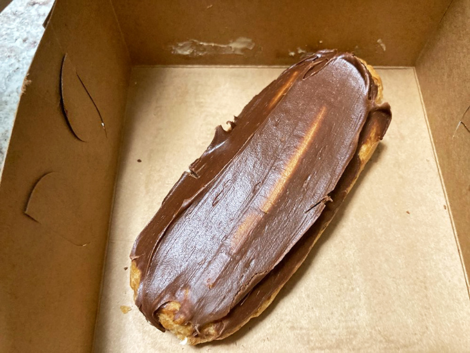 This chocolate &eacute;clair isn't just dessert &ndash; it's a commitment to excellence, with a glossy top hiding a creamy center that's worth breaking diets for.
