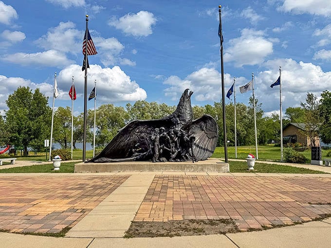 The powerful eagle sculpture at the Veterans Memorial spreads its wings against Minnesota skies, honoring Iron Range service members.