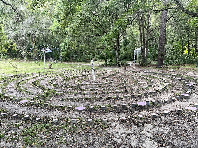 Stone labyrinth invites contemplative walking, a meditative counterpoint to the whimsical fairy homes scattered throughout the park.