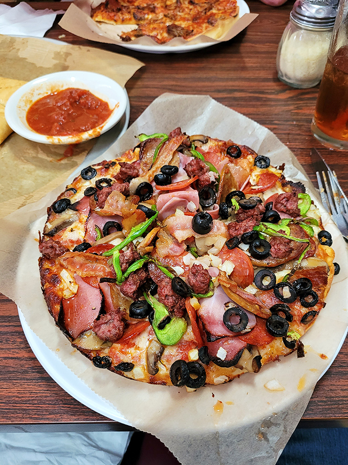 The "Loaded" pizza lives up to its name, a carnival of toppings that somehow harmonizes instead of overwhelming.