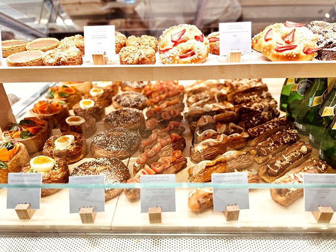 The pastry display case should come with a warning sign: "Prolonged viewing may cause spontaneous drooling and impulsive purchasing decisions."