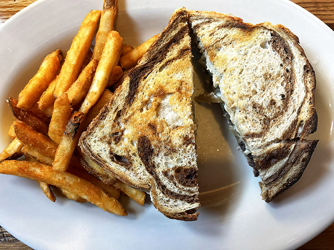 The perfect patty melt – where caramelized onions, melted cheese, and grilled rye bread create a symphony of comfort food bliss.