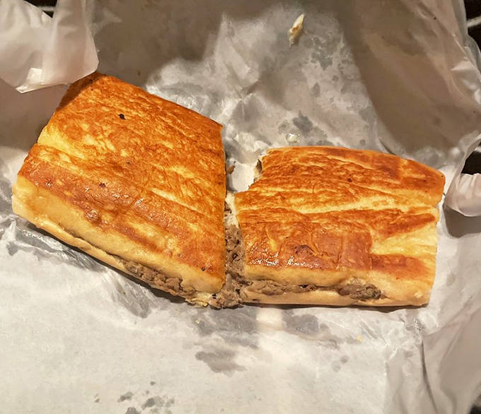 Thinly sliced steak, melted cheese, and the perfect press make this Philly cheesesteak a worthy alternative to the Cuban sandwiches that made Strawberry Hut famous.