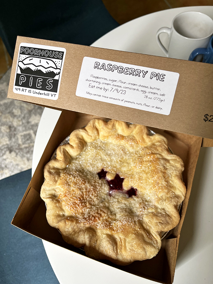 Golden-crusted and sugar-dusted, this raspberry pie reveals its ruby treasures through carefully placed vents&mdash;edible stained glass windows.