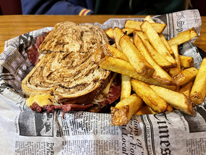 The Reuben sandwich showcases perfectly tender corned beef and tangy sauerkraut between grilled rye, a deli classic done right.