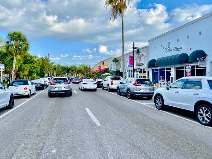 Palm-lined streets create natural canopies for shoppers, turning a simple stroll into a scenic adventure between boutiques.