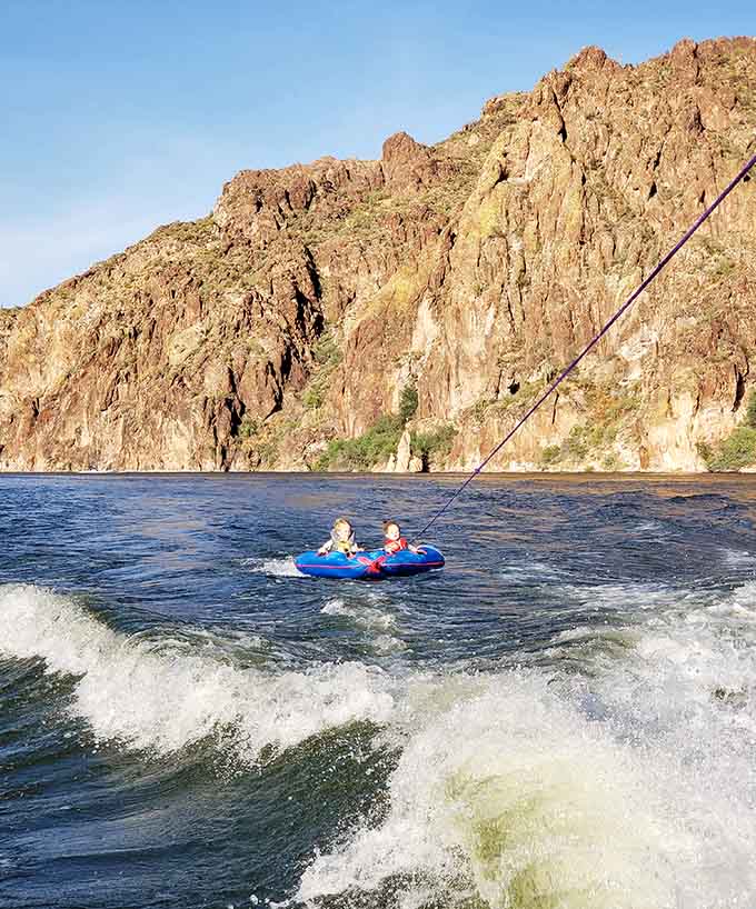 Kids getting pulled on tubes behind boats experience the kind of joy that makes adults remember why summer vacation was the best invention ever.