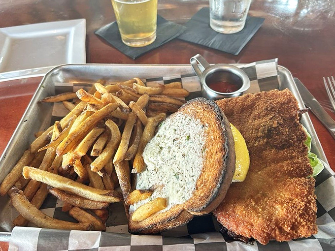 German tradition meets American sandwich innovation in this crispy, golden-fried masterpiece that demands two hands and zero distractions.