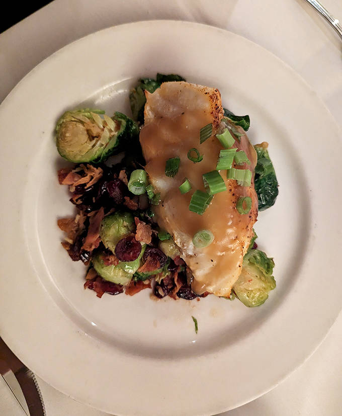 Sea Bass: Delicate fish meets robust flavors&mdash;the sea bass arrives perfectly seared, accompanied by Brussels sprouts that even vegetable skeptics would devour.