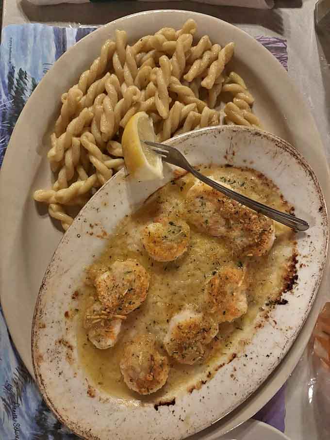 Shrimp de Jonghe swimming in garlic butter alongside pasta, basically a love letter to anyone who thinks butter is a food group.