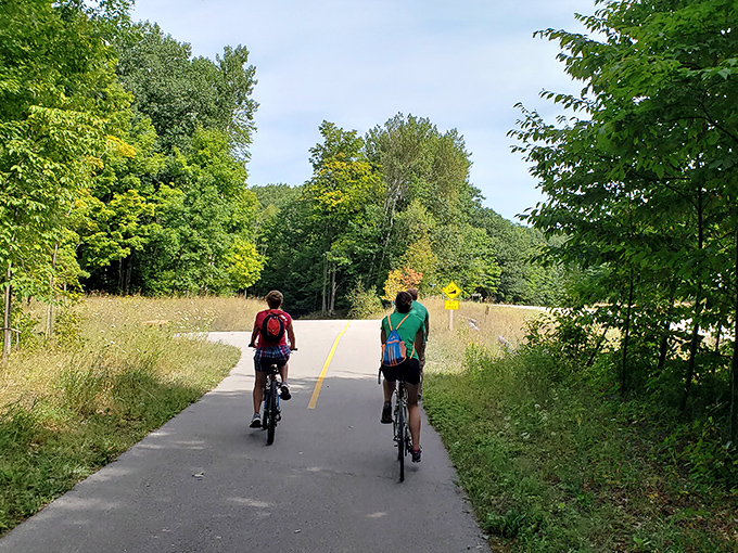 The Sleeping Bear Heritage Trail beckons cyclists to explore miles of scenic pathways connecting Empire's natural wonders.