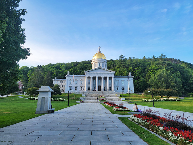 Vermont's State House stands proudly against verdant hills, its gold dome gleaming like a beacon of democracy that refuses to be overshadowed.