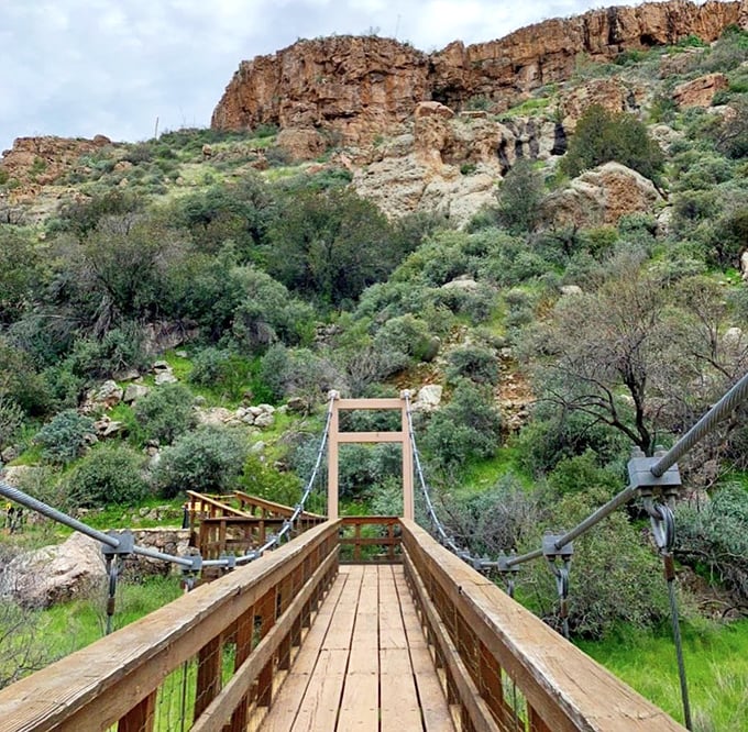 Crossing this wooden suspension bridge feels like stepping into an adventure movie – minus the perilous crocodiles below.