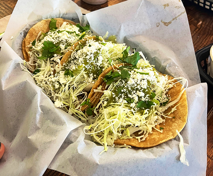 These aren't just tacos – they're tiny flavor festivals topped with fresh cabbage, cilantro, and a sprinkle of queso fresco.