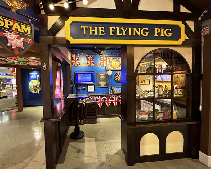 Fancy a pint? The Flying Pig Pub area offers British-themed fun with Union Jack bunting, dartboards, and vintage advertisements celebrating SPAM's international appeal.