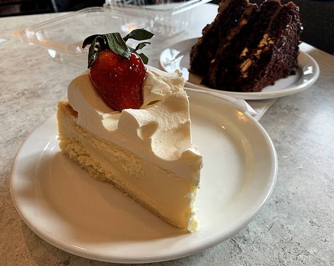 Cloud-like perfection crowned with a strawberry sentinel, this cake doesn't just melt in your mouth, it performs a disappearing act.