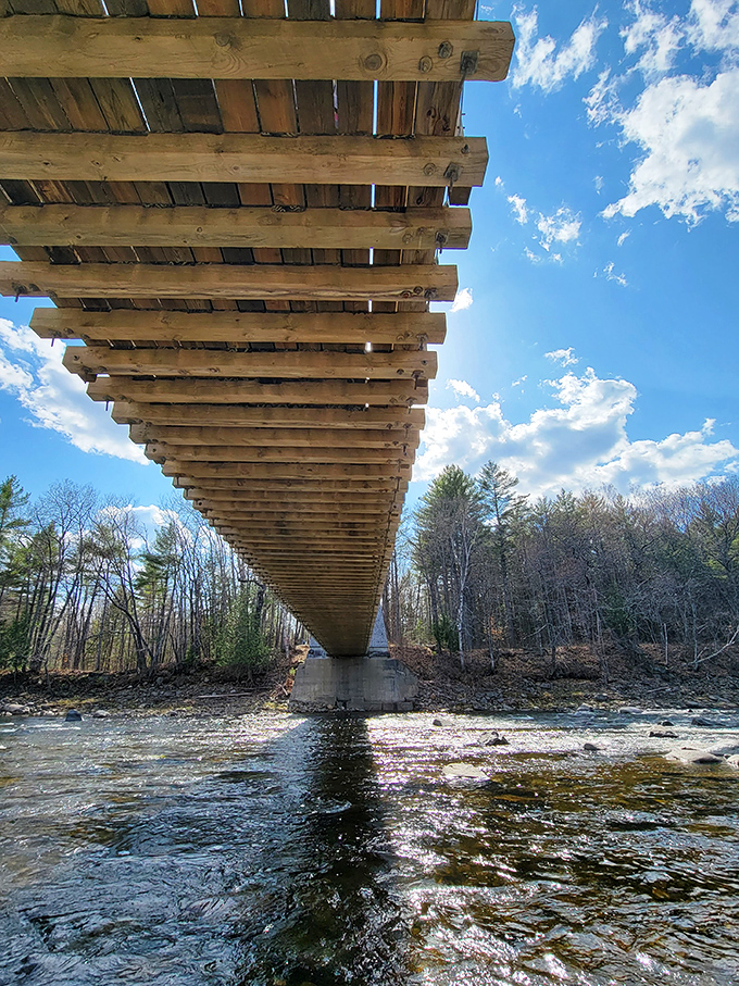 From below, the bridge's wooden underbelly reveals the ingenious engineering that has kept it standing for over 150 years.
