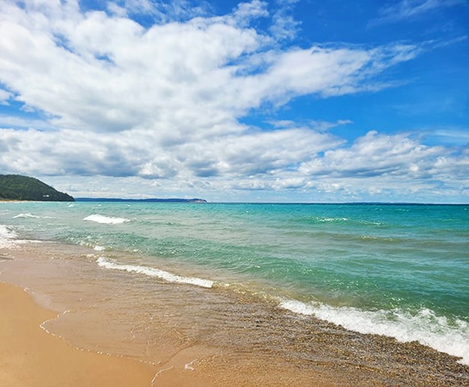 Van's Beach offers that perfect Michigan summer moment – toes in the sand, endless blue horizon, and water that sparkles like it's showing off.