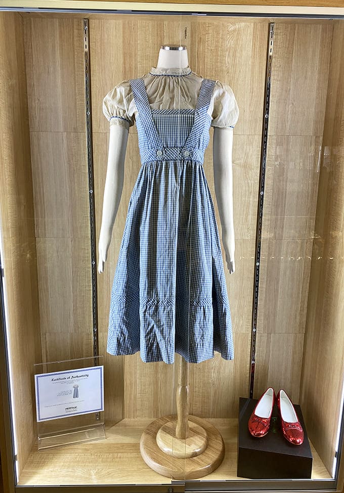 Dorothy's authentic blue gingham dress hangs like a celebrity from Hollywood's golden age, minus the scandal and plus all the nostalgia.