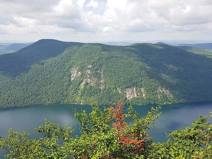 From up here, the lake looks like someone drew a perfect blue line between the mountains using a very expensive celestial marker.