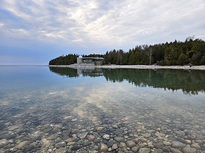 Crystal clear waters mirror the sky above, creating a double feature of natural beauty that's worth the trip alone.