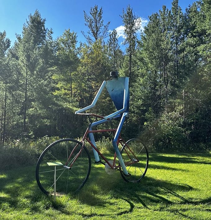 The park's iconic blue cyclist seems perpetually caught between movement and stillness &ndash; a meditation on journey rather than destination.