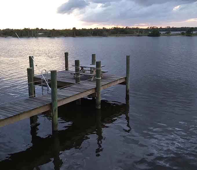 These weathered docks stretching into the Halifax River have seen more sunrises and successful fishing trips than most of us have had hot dinners, and they're still standing strong.