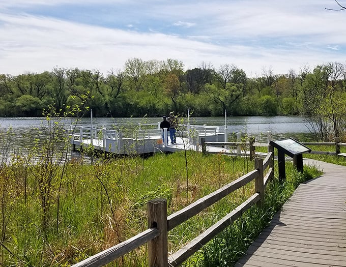 Fishing enthusiasts and daydreamers alike find solace on this peaceful dock, where Mallard Lake's waters reflect Wisconsin's ever-changing skies.